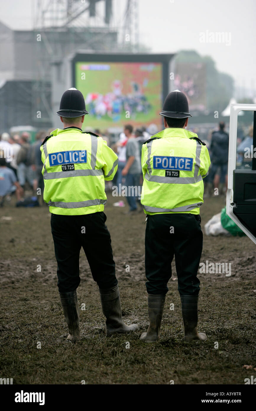Police watching large screen at the Glastonbury music festival Stock ...