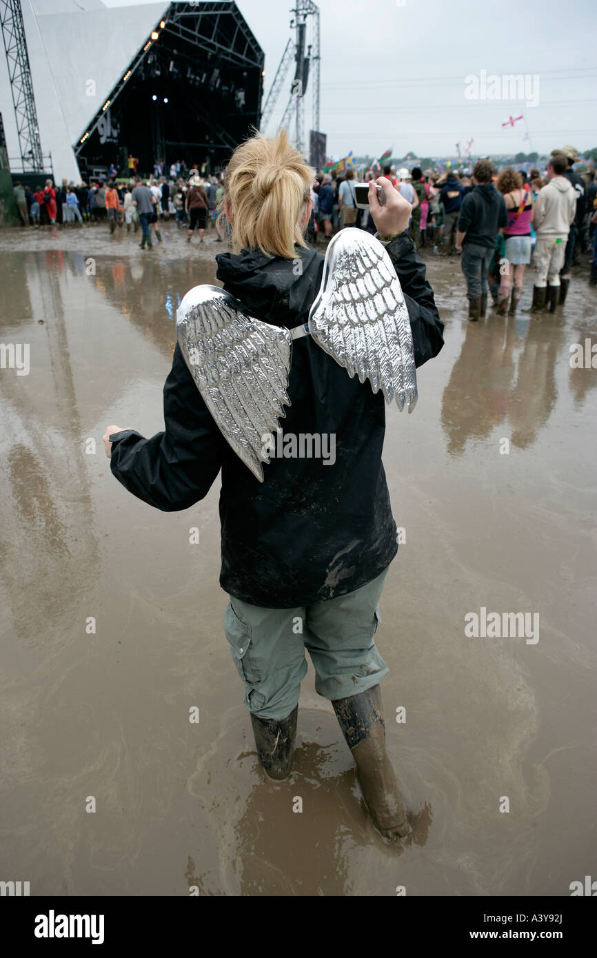 Spectator at a very muddy glastonbury in 2005 Stock Photo - Alamy