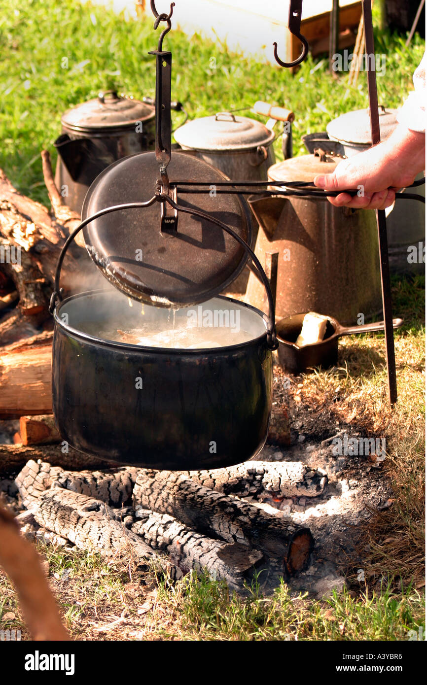 Woman cooking over open fire hi-res stock photography and images - Alamy