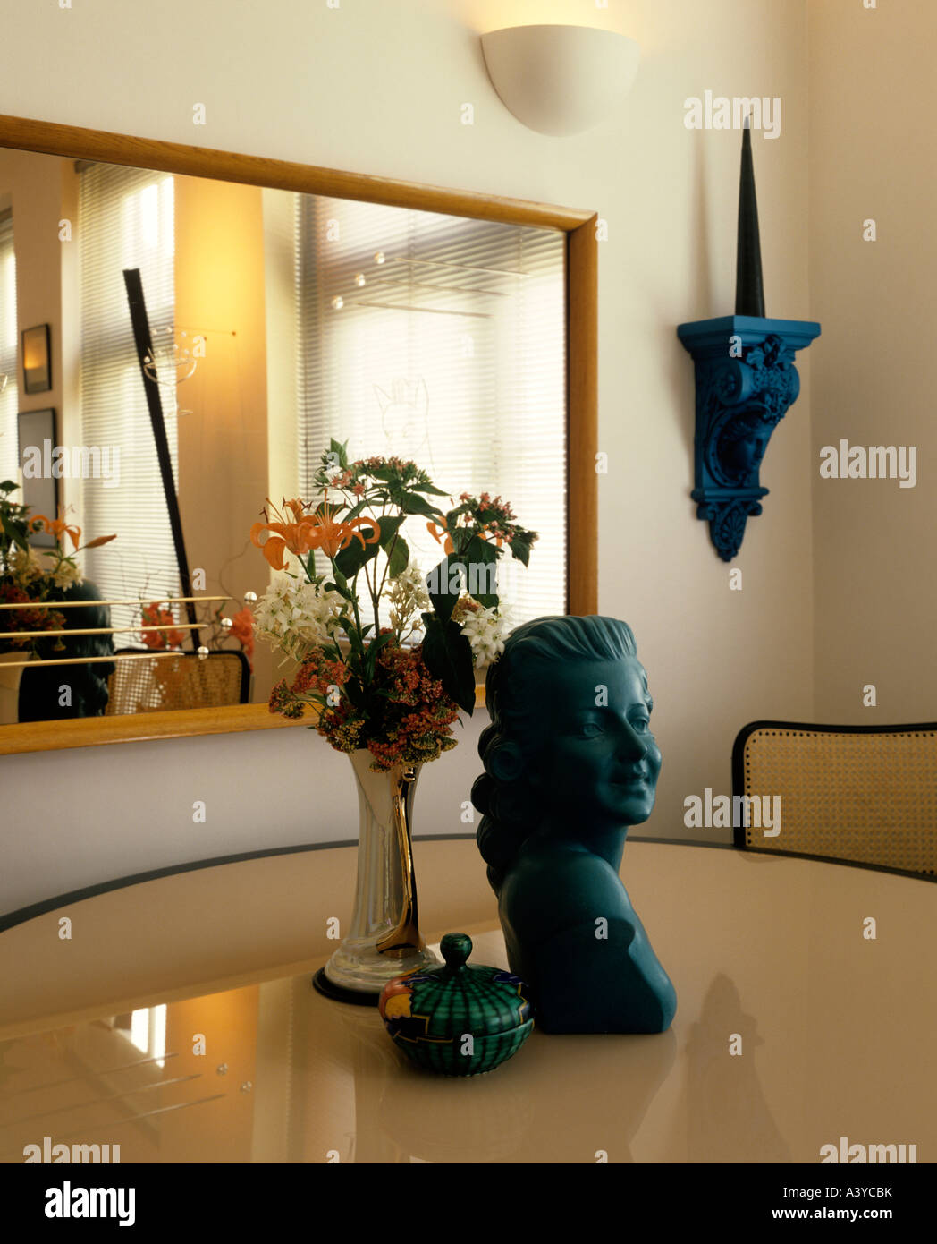 table with bust and flower display in a 1960's period interior Stock ...