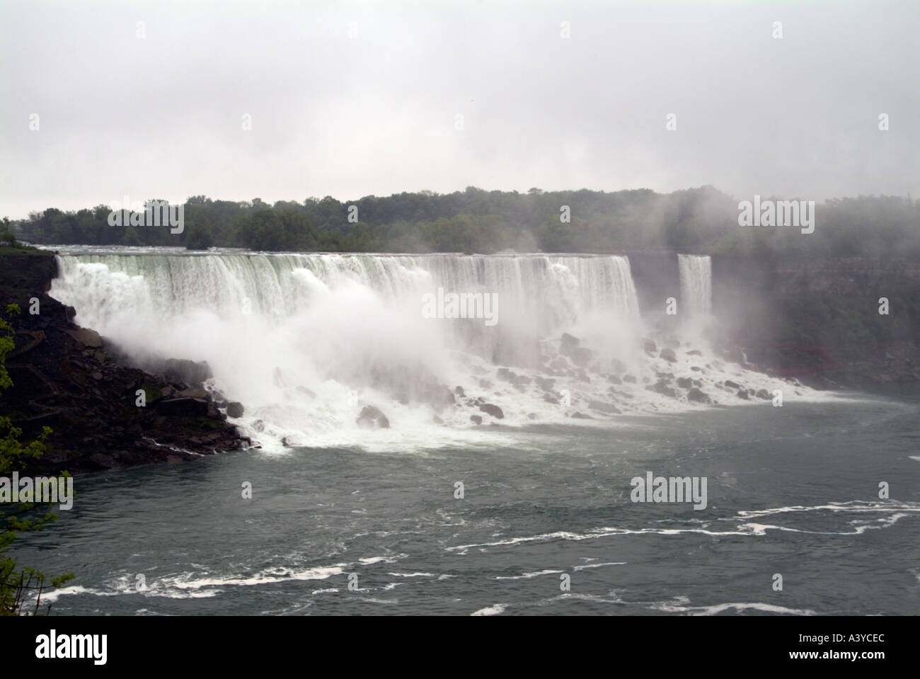Niagara Falls side view mist cloudy day falling water on rocks natural ...