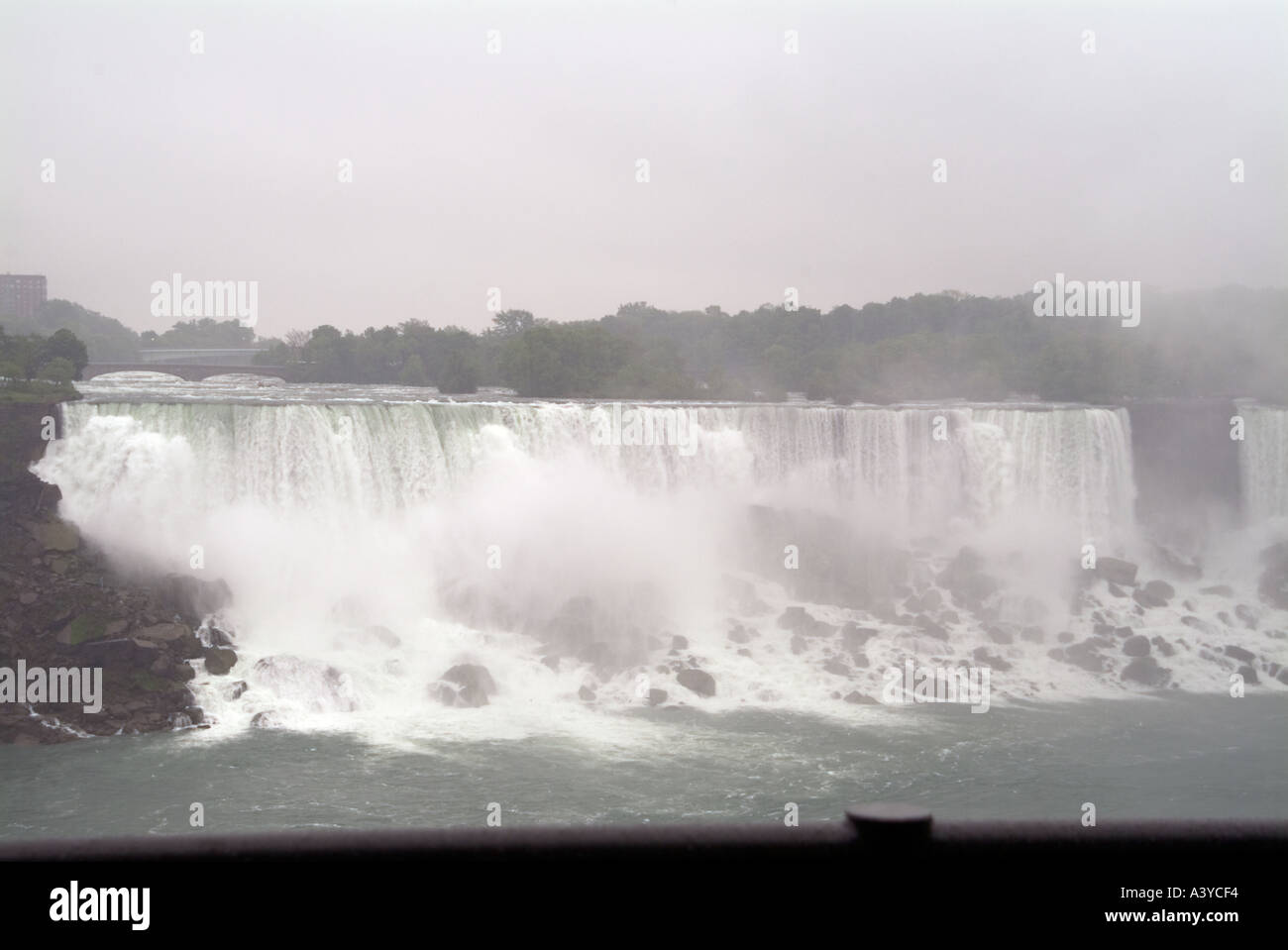 Niagara Falls side view mist cloudy day falling water on rocks natural ...