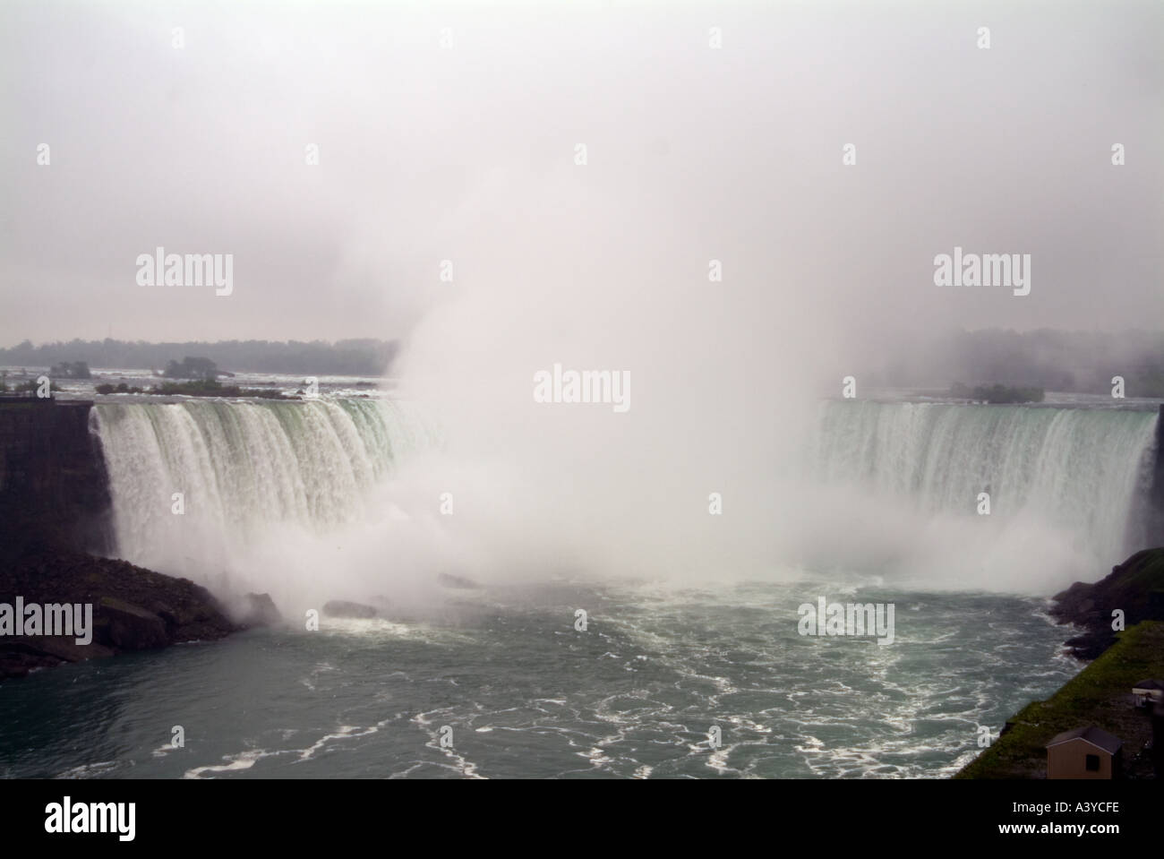 Niagara Falls front view mist cloudy day falling water on rocks natural ...