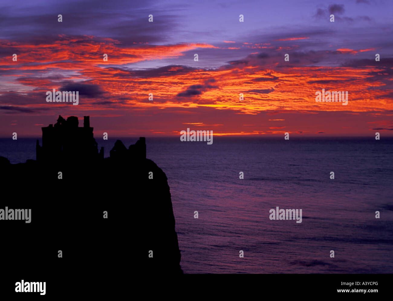 Landscape format image of a silhouetted Dunnottar castle near ...