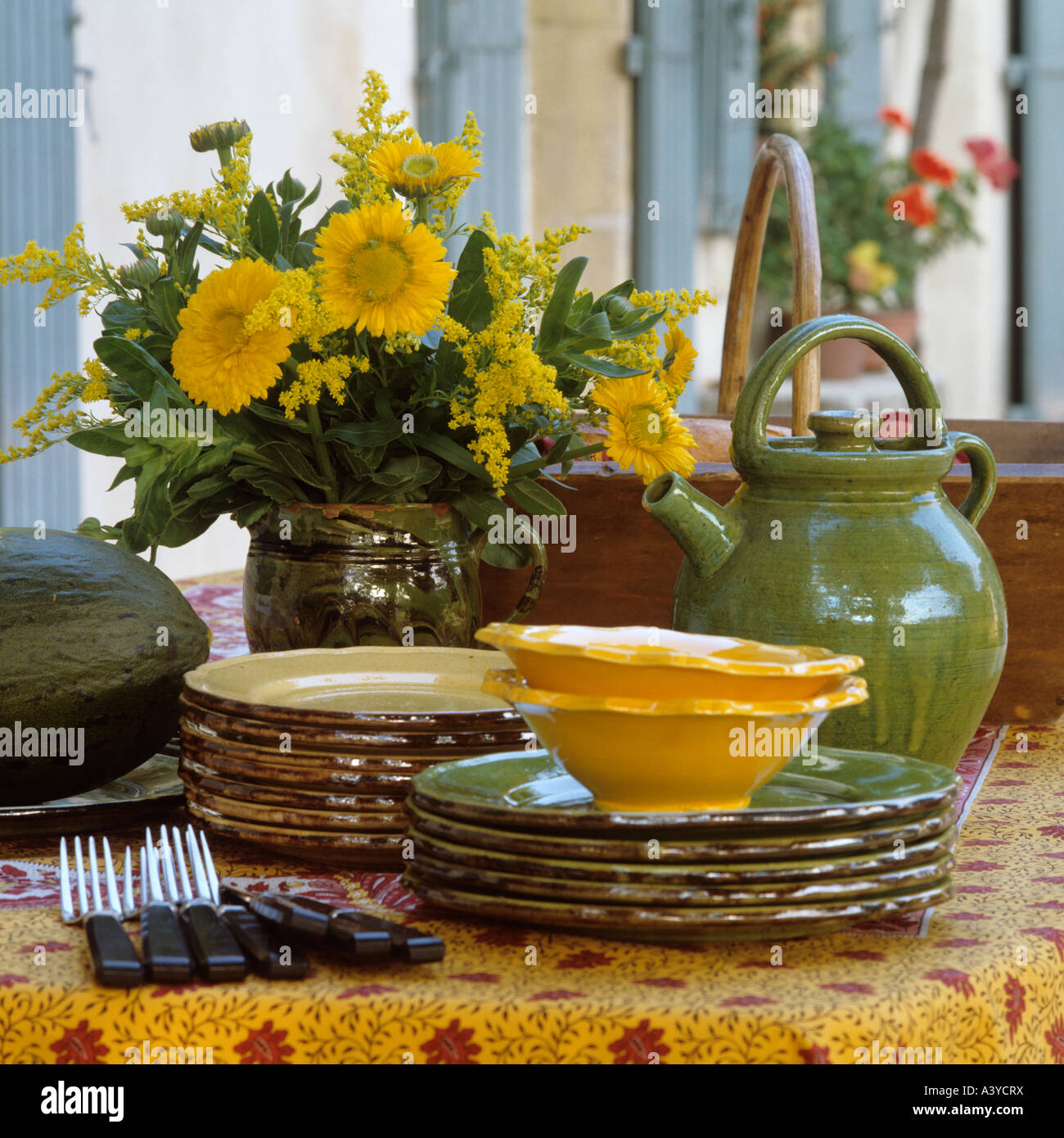 detail of table with Provençal pottery with sunflower Stock Photo - Alamy