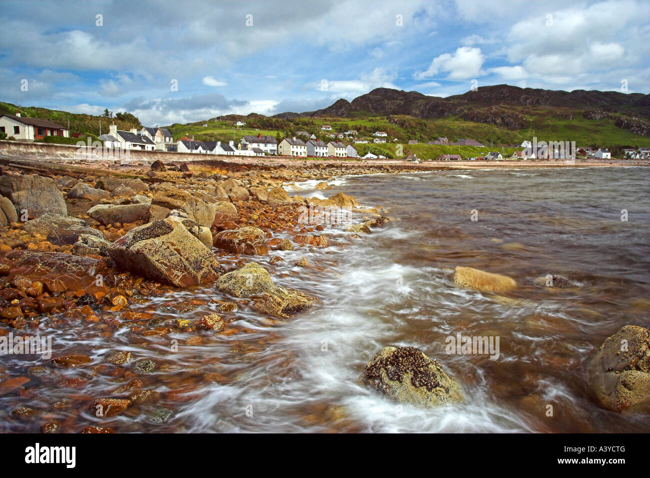 Gairloch Scottish Highlands beach view with mussel covered rocks in ...