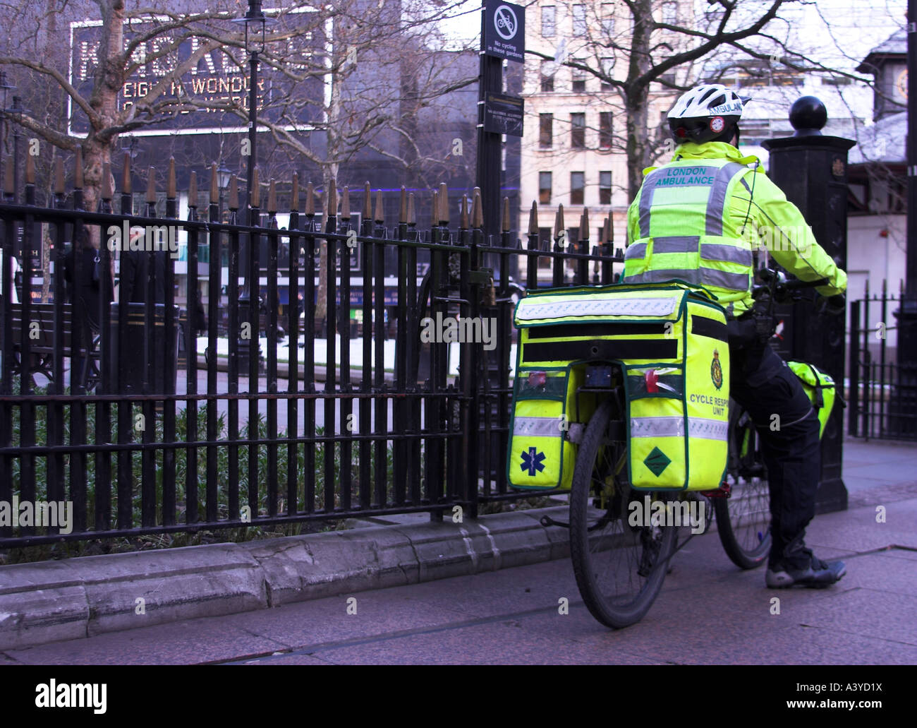 A bicycle paramedic dressed in bright green taking a break in Leciester ...