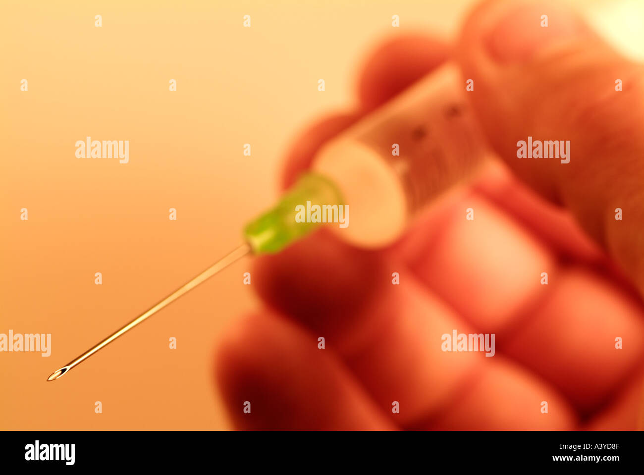 Hand Holding a Syringe Ready to Inject Stock Photo - Alamy