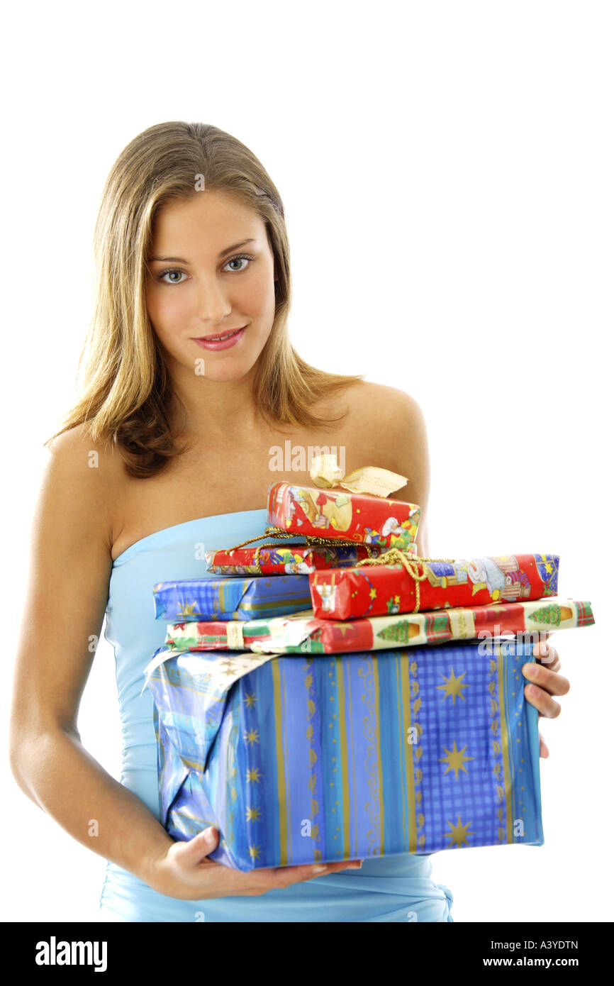 young woman carrying Christmas presents Stock Photo - Alamy