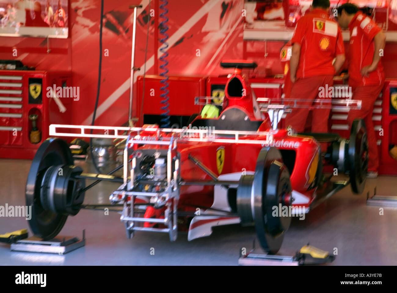 Formula 1 racing car pit lane inside garage front body view Gilles ...