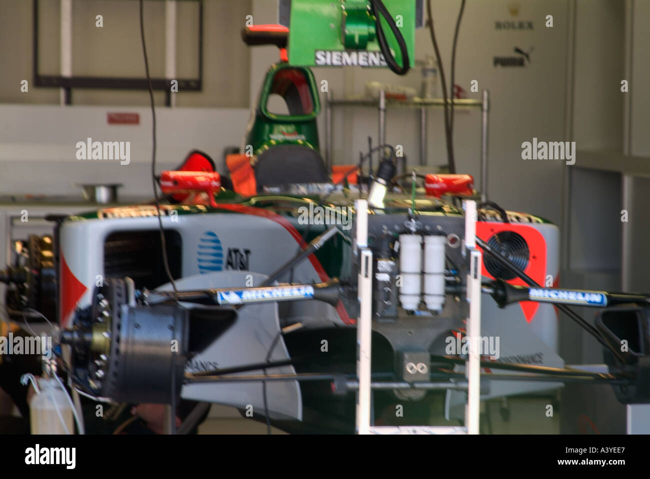 Formula 1 racing car pit lane inside garage mechanics working Gilles ...