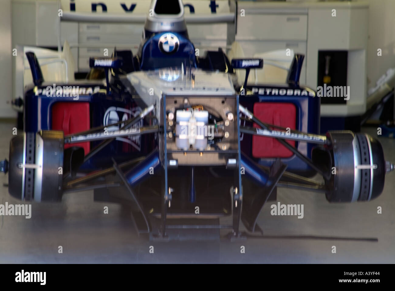 Formula 1 racing car pit lane inside garage front body view Gilles ...