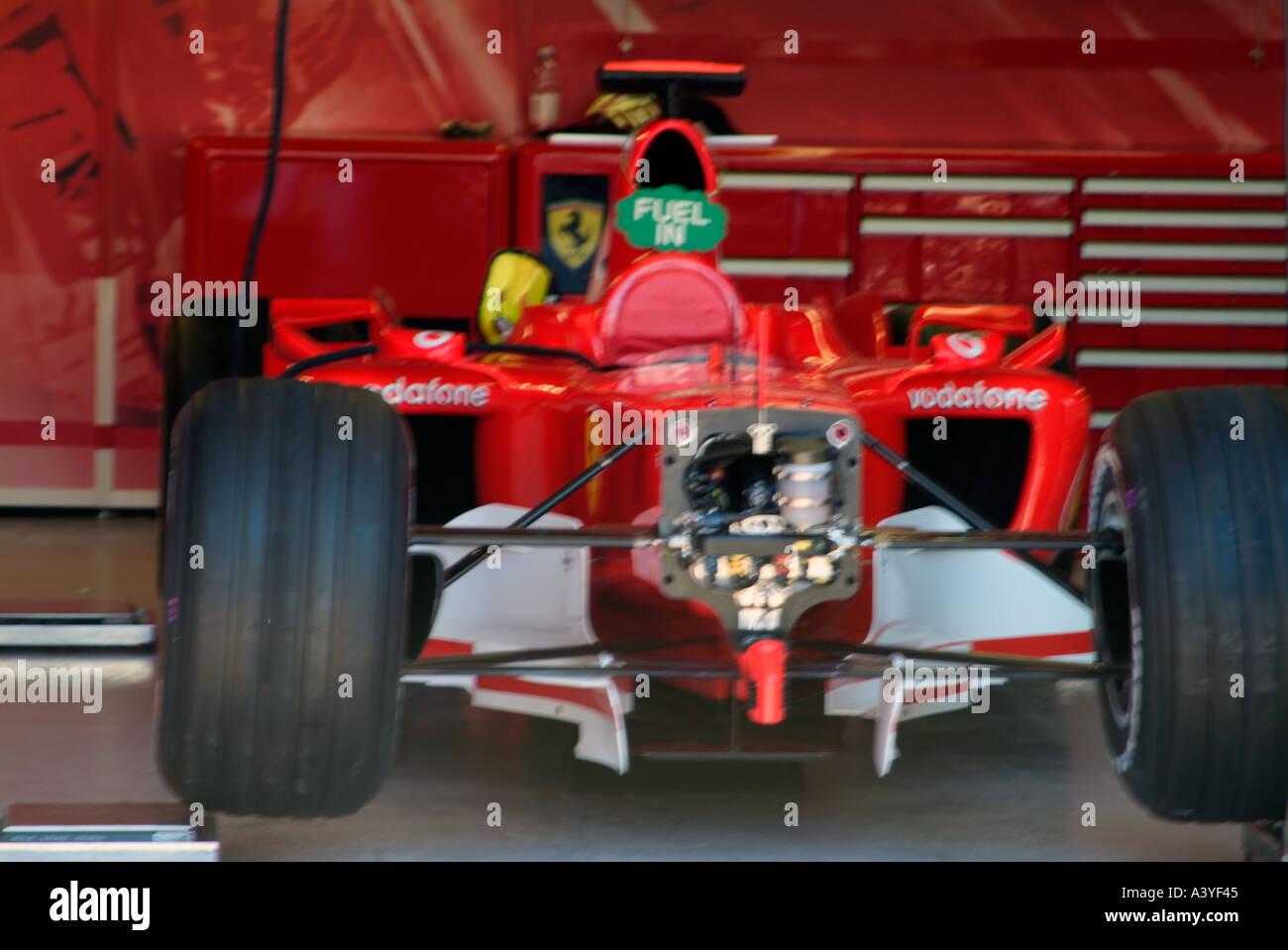Formula 1 racing car pit lane inside garage front body view Gilles ...