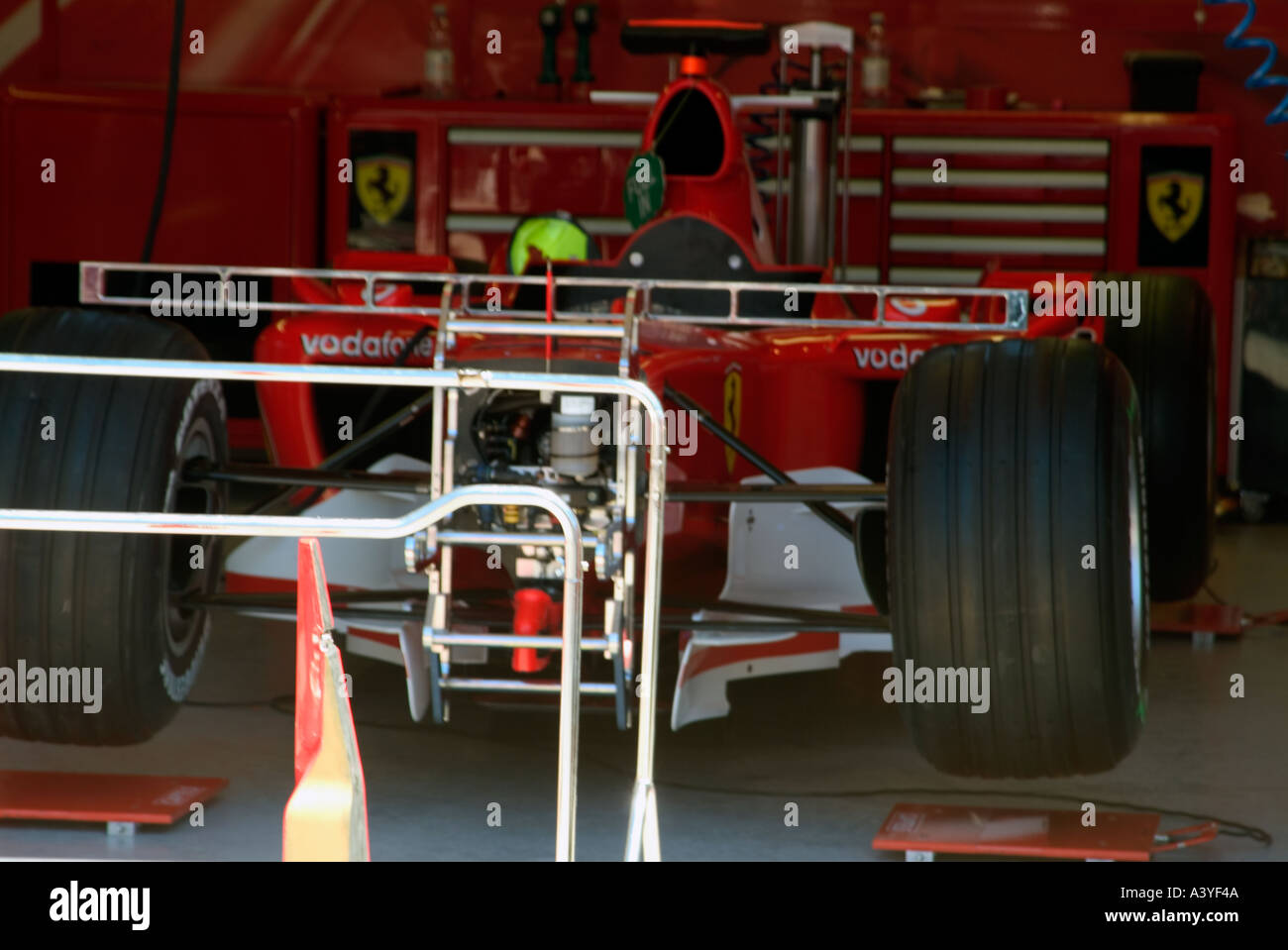 Formula 1 racing car pit lane inside garage front body view Gilles ...