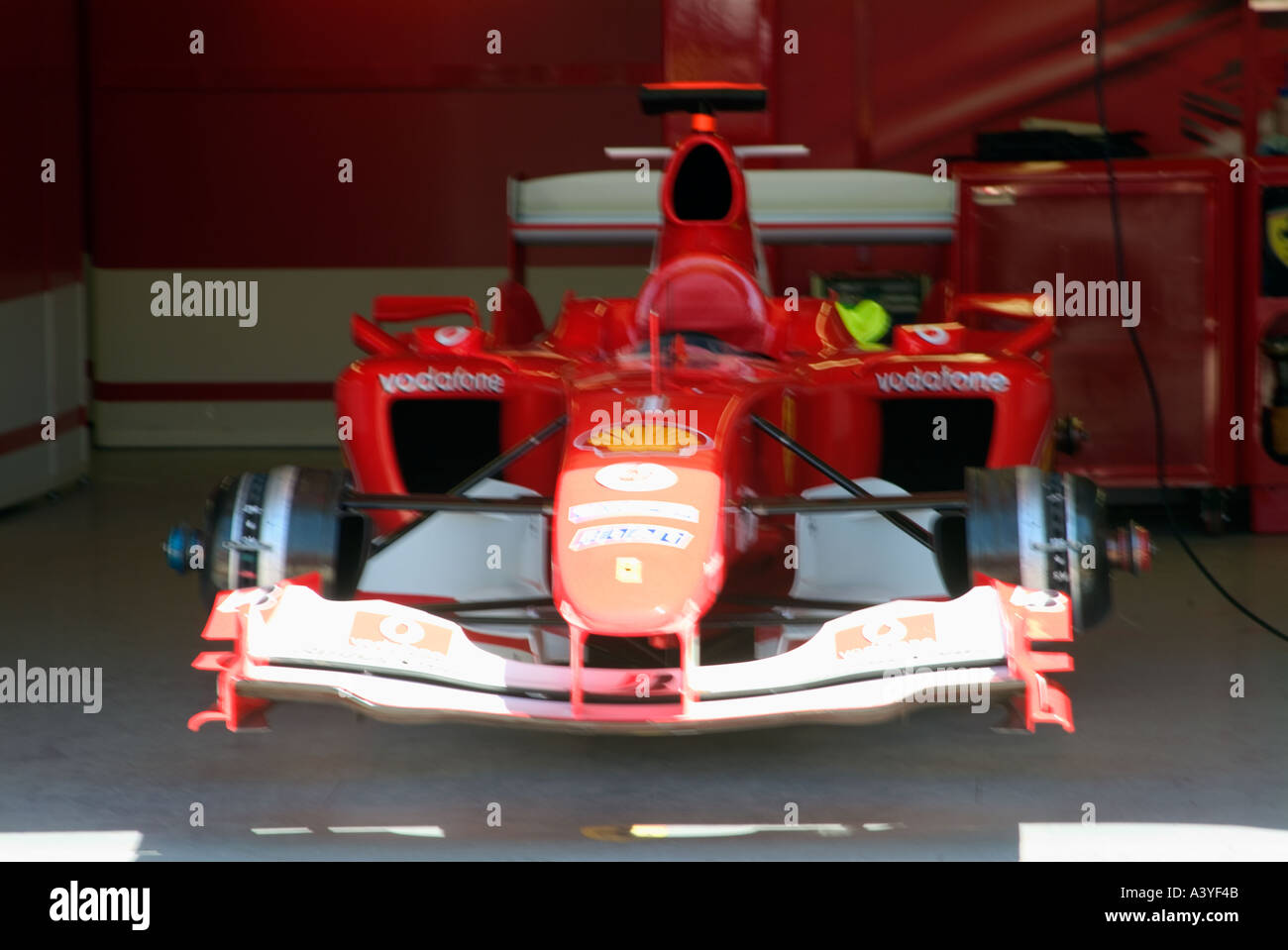 Formula 1 racing car pit lane inside garage front body view Gilles ...