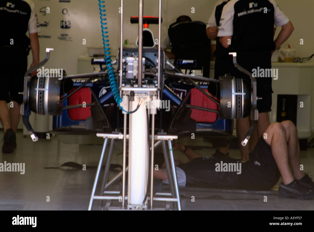 Formula 1 racing car pit lane inside garage rear body view Gilles ...