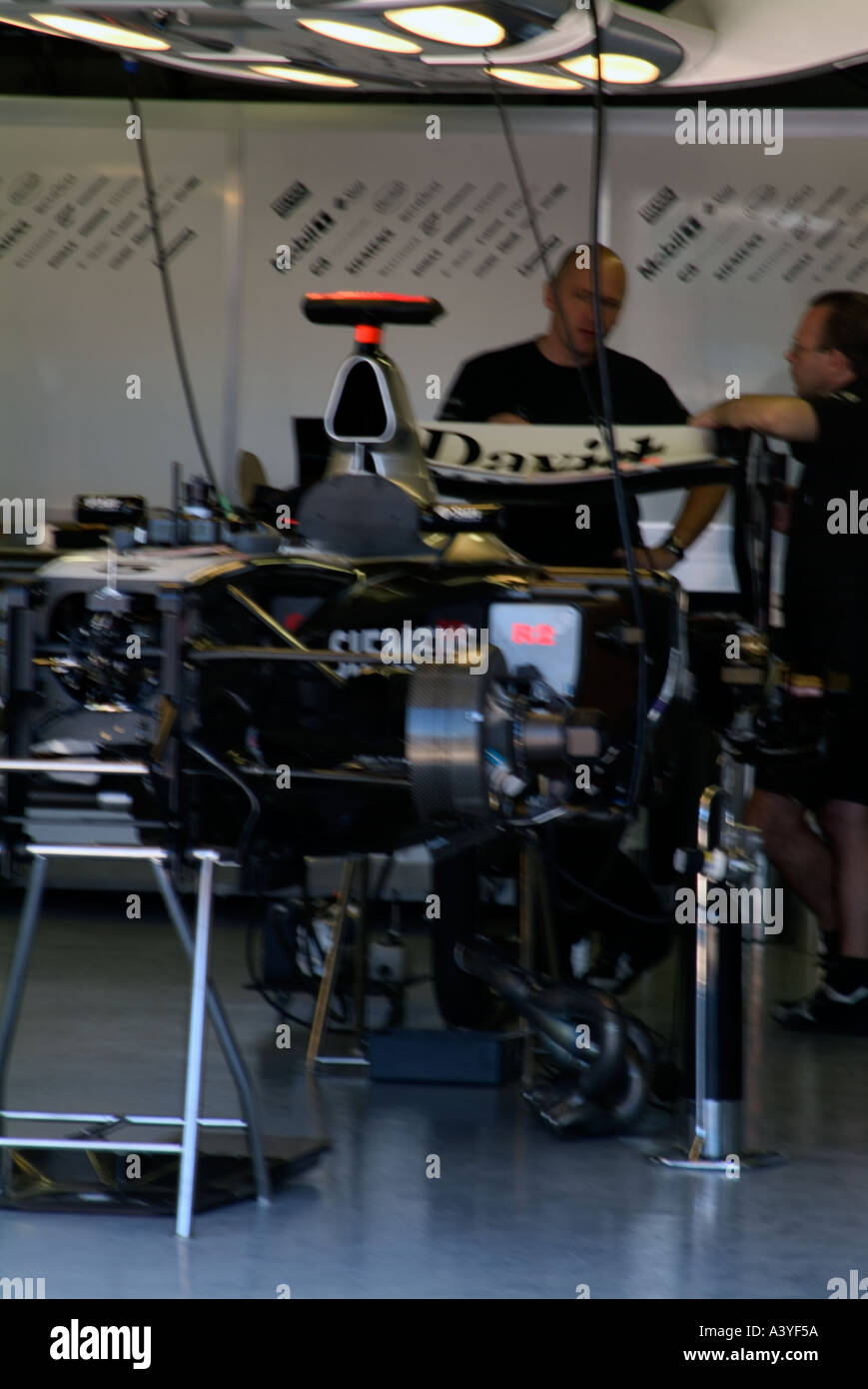 Formula 1 racing car pit lane inside garage front body view Gilles ...