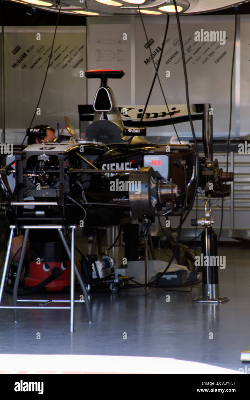 Formula 1 racing car pit lane inside garage front body view Gilles ...