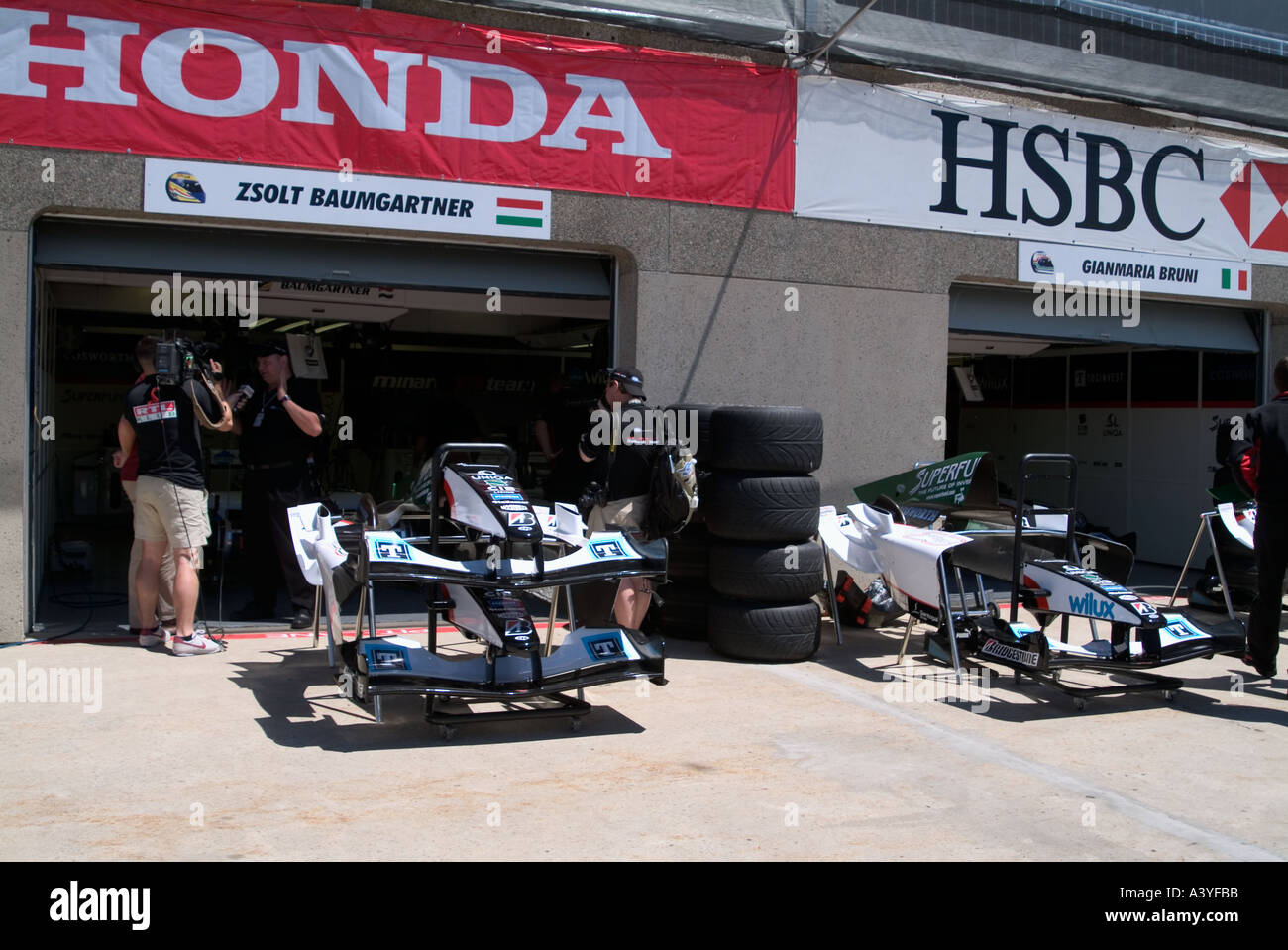 Formula 1 racing car pit lane front garages honda mechanics Gilles ...