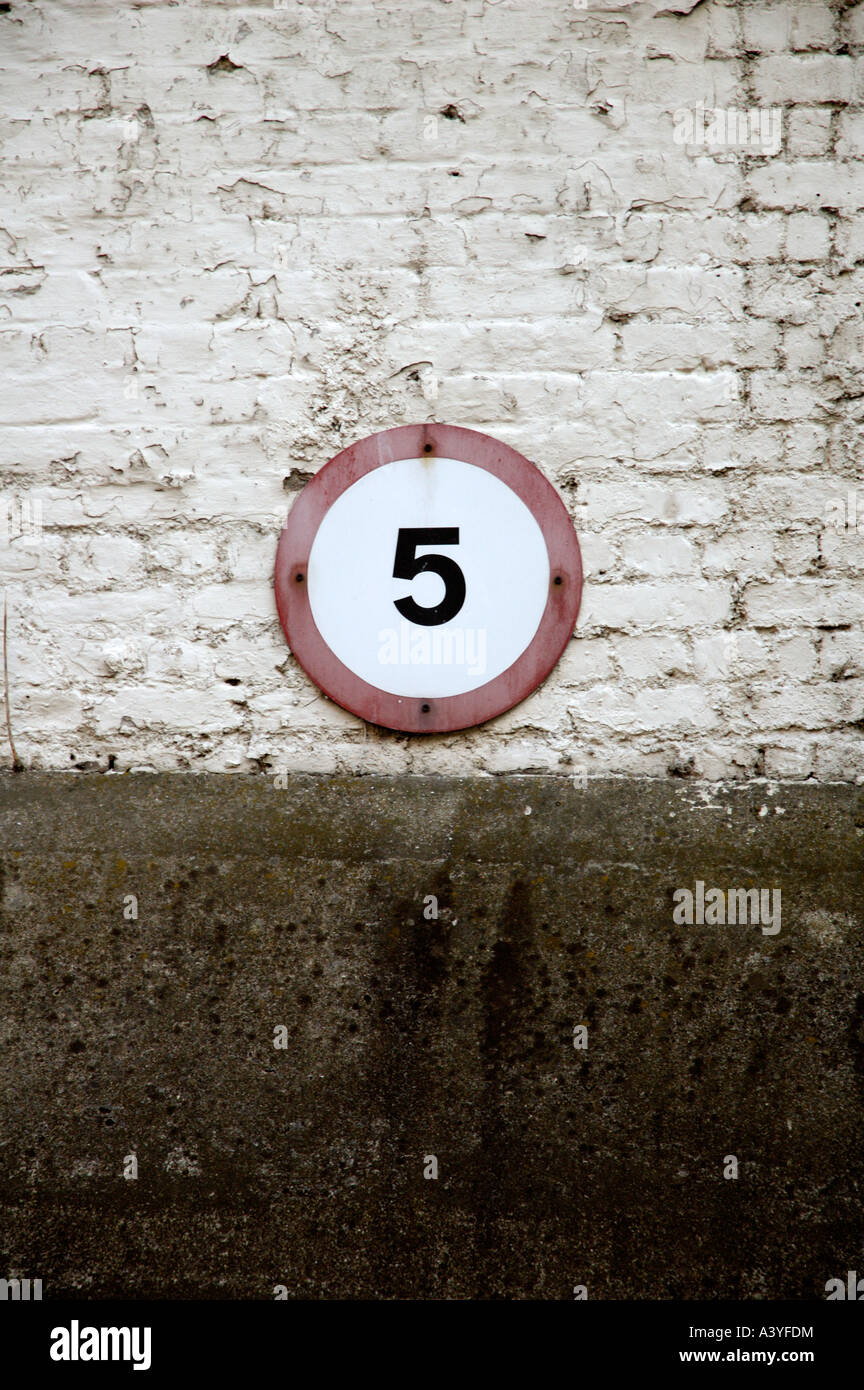 5 speed limit sign on a whitewashed brick wall in London England UK ...