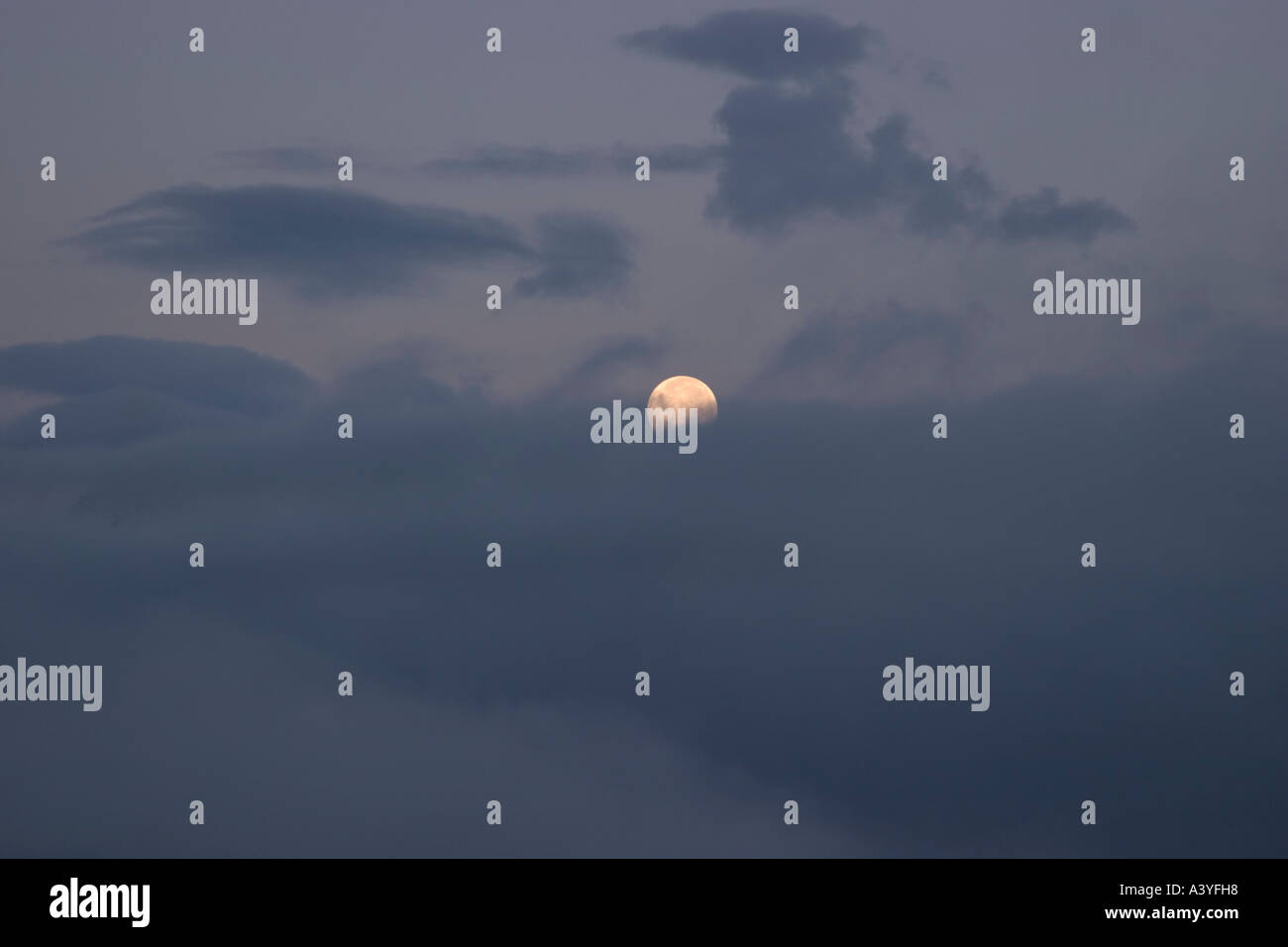 Full Moon Setting Stock Photo - Alamy