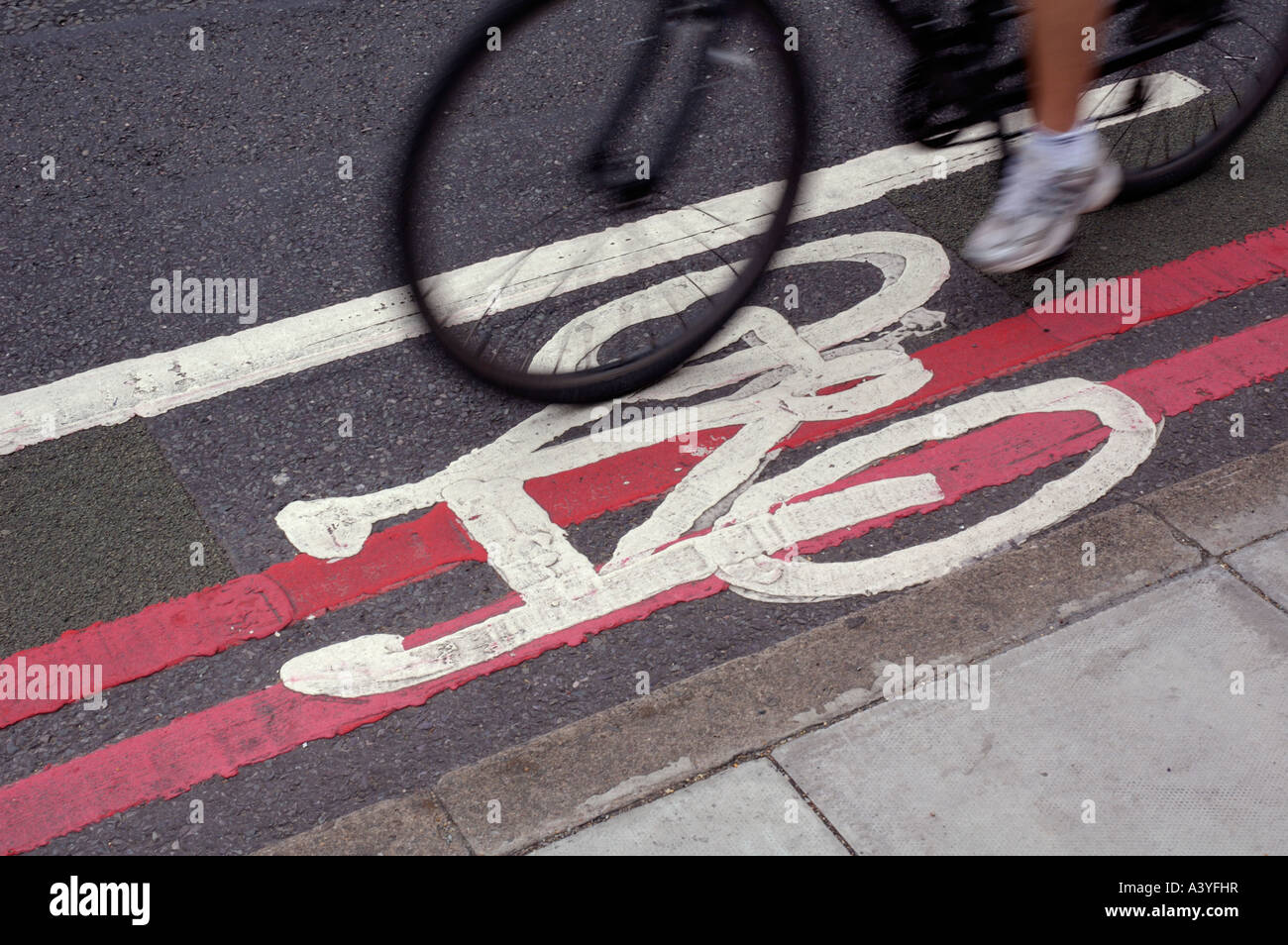 cyclist in London England UK rides along a bike path on Vauxhall Bridge ...