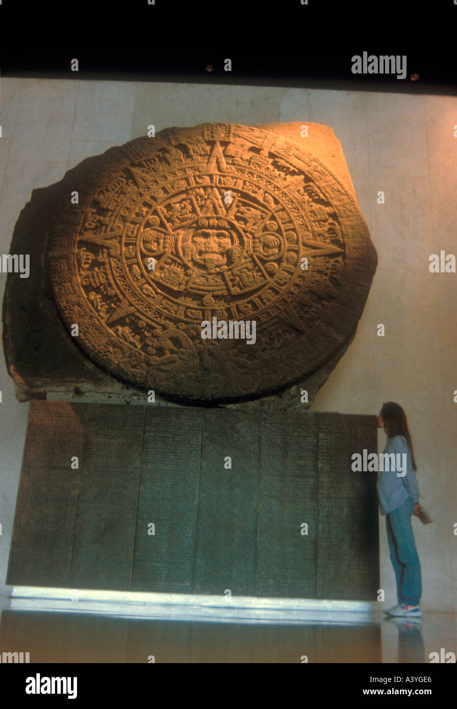 Woman loking the Aztec calendar at Archeology and Antropology museum at ...
