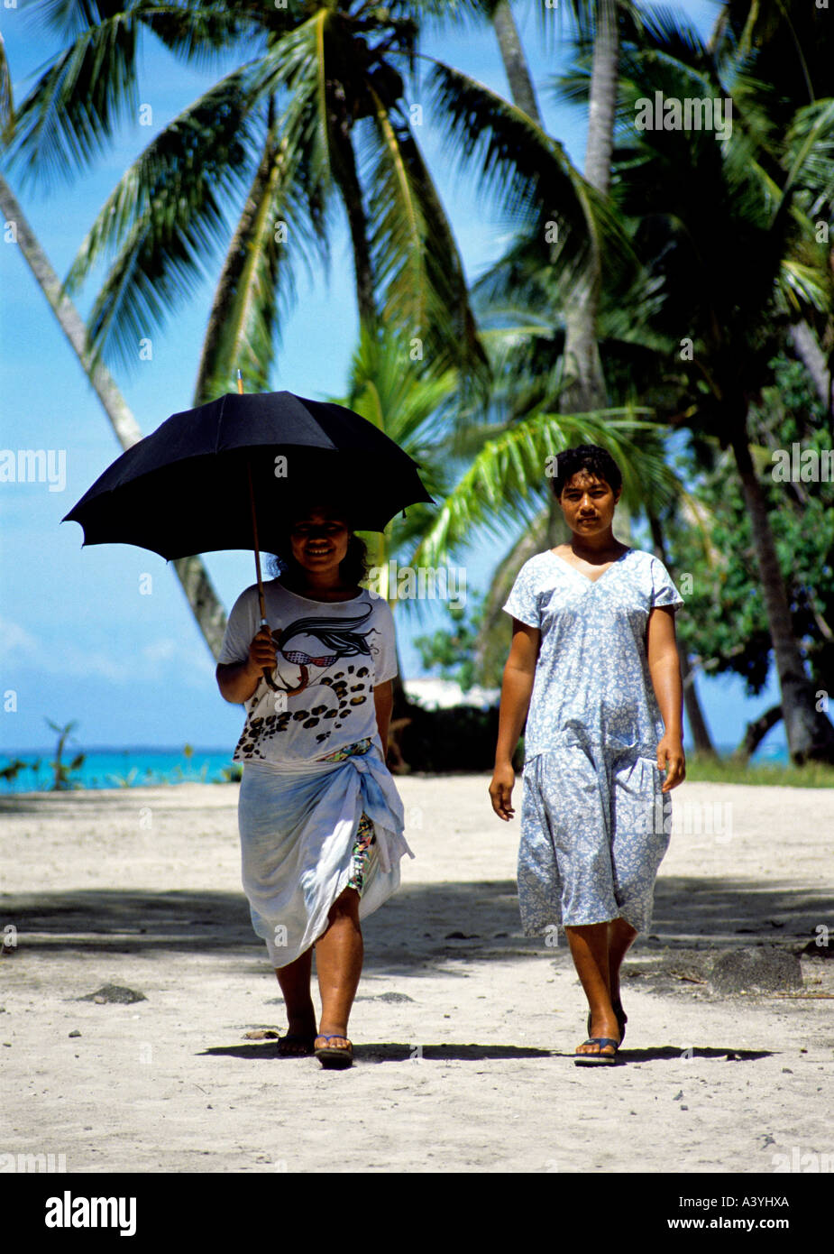 portrait of women walking at beach islands of western samoa archipelago ...