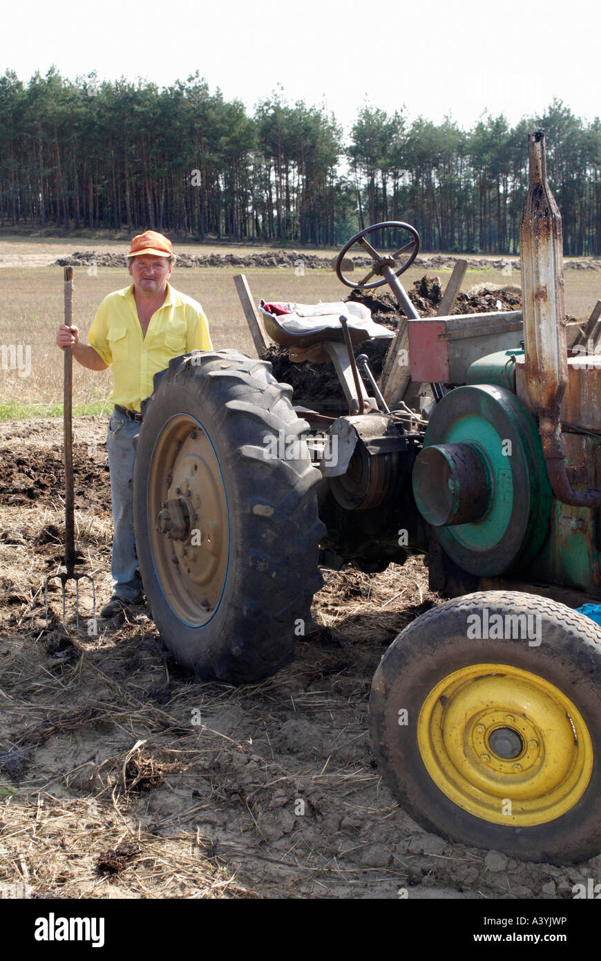 A farmer on a traditional farm in Poland Stock Photo - Alamy