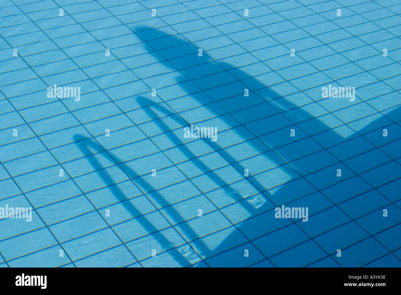 Shadow of Girl and Handrails in Swimming Pool Stock Photo - Alamy