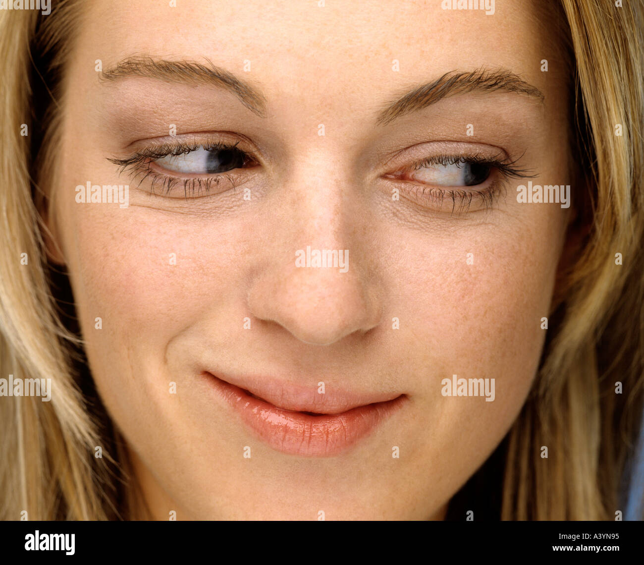 portrait of curious looking woman Stock Photo - Alamy