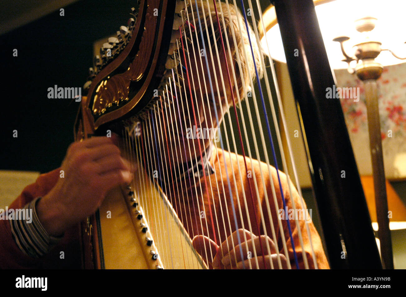 Playing harp hi-res stock photography and images - Alamy