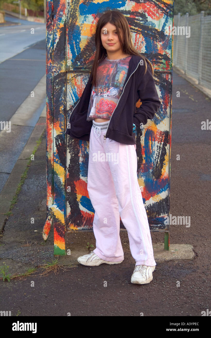 A sophisticated cool-looking long haired 9 year old girl looking far ...