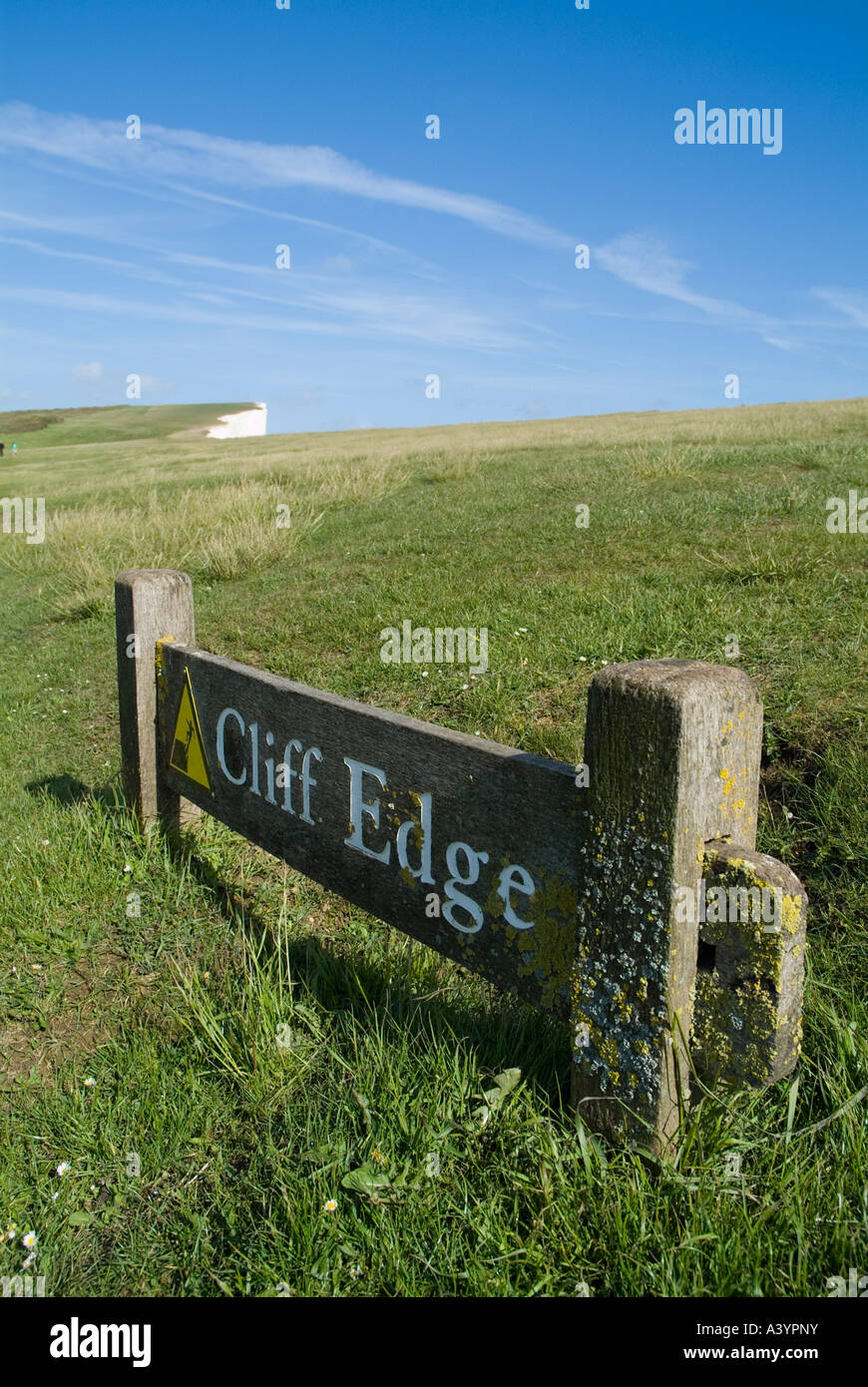 Warning sign at the edge of the cliffs at Beachy Head, East Sussex ...