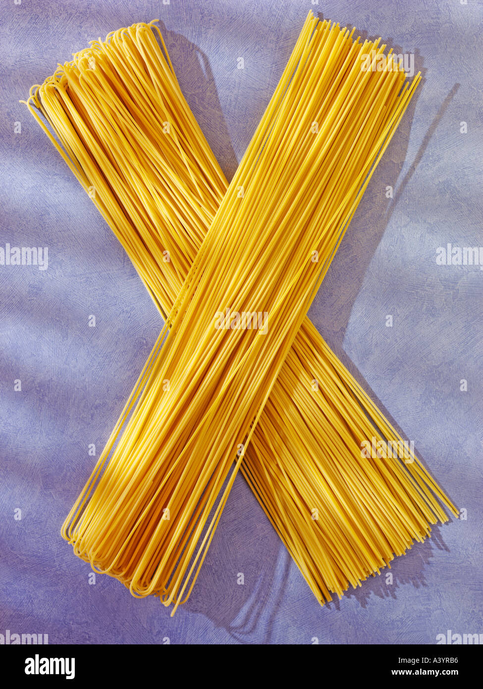 Long spaghetti on blue hi-res stock photography and images - Alamy