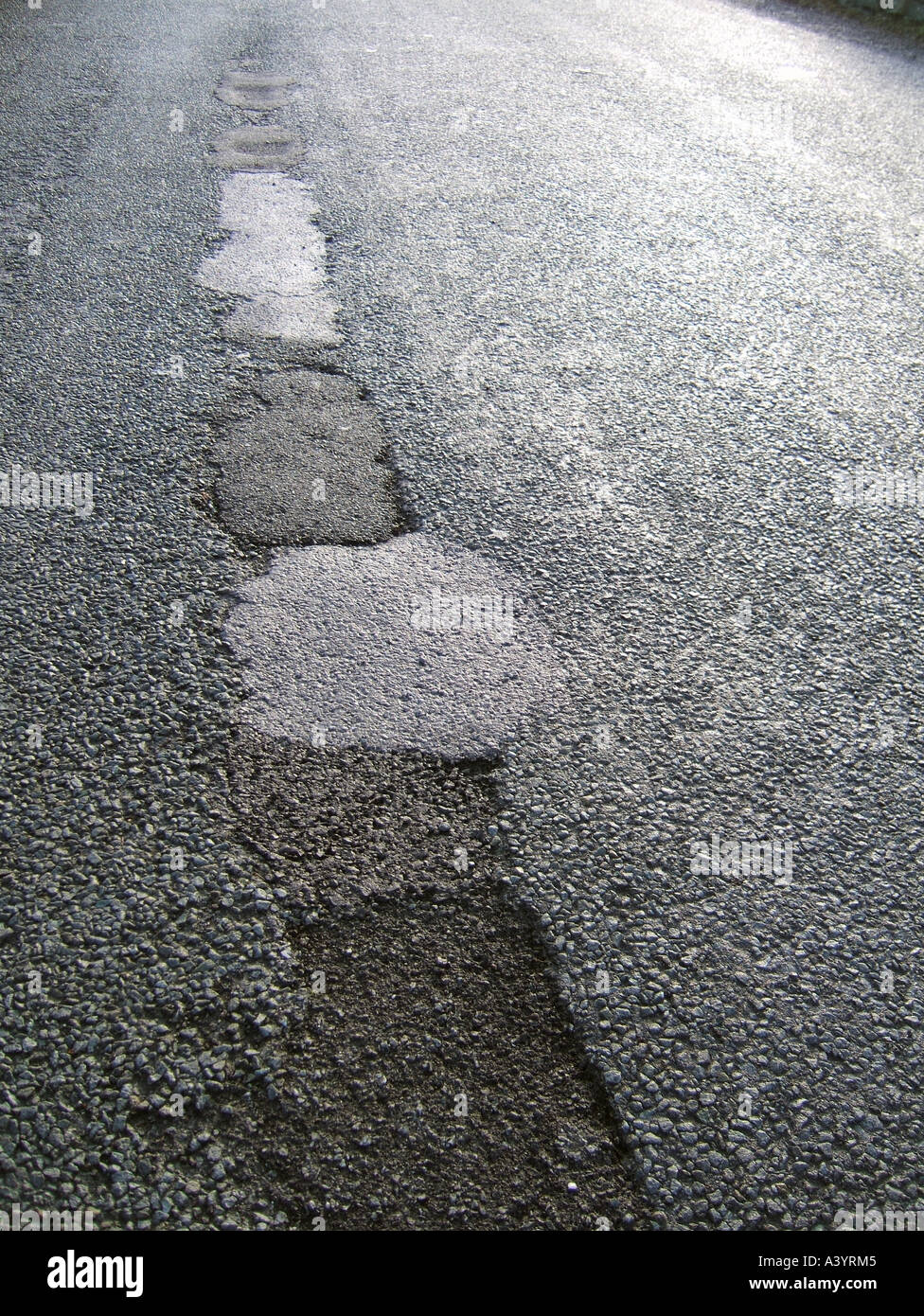 patched up road Stock Photo - Alamy