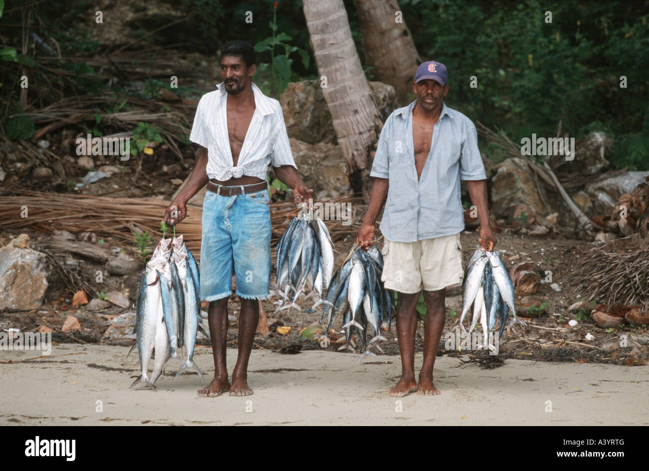 two fishermen with caught fishes, Dominican Republic Stock Photo - Alamy