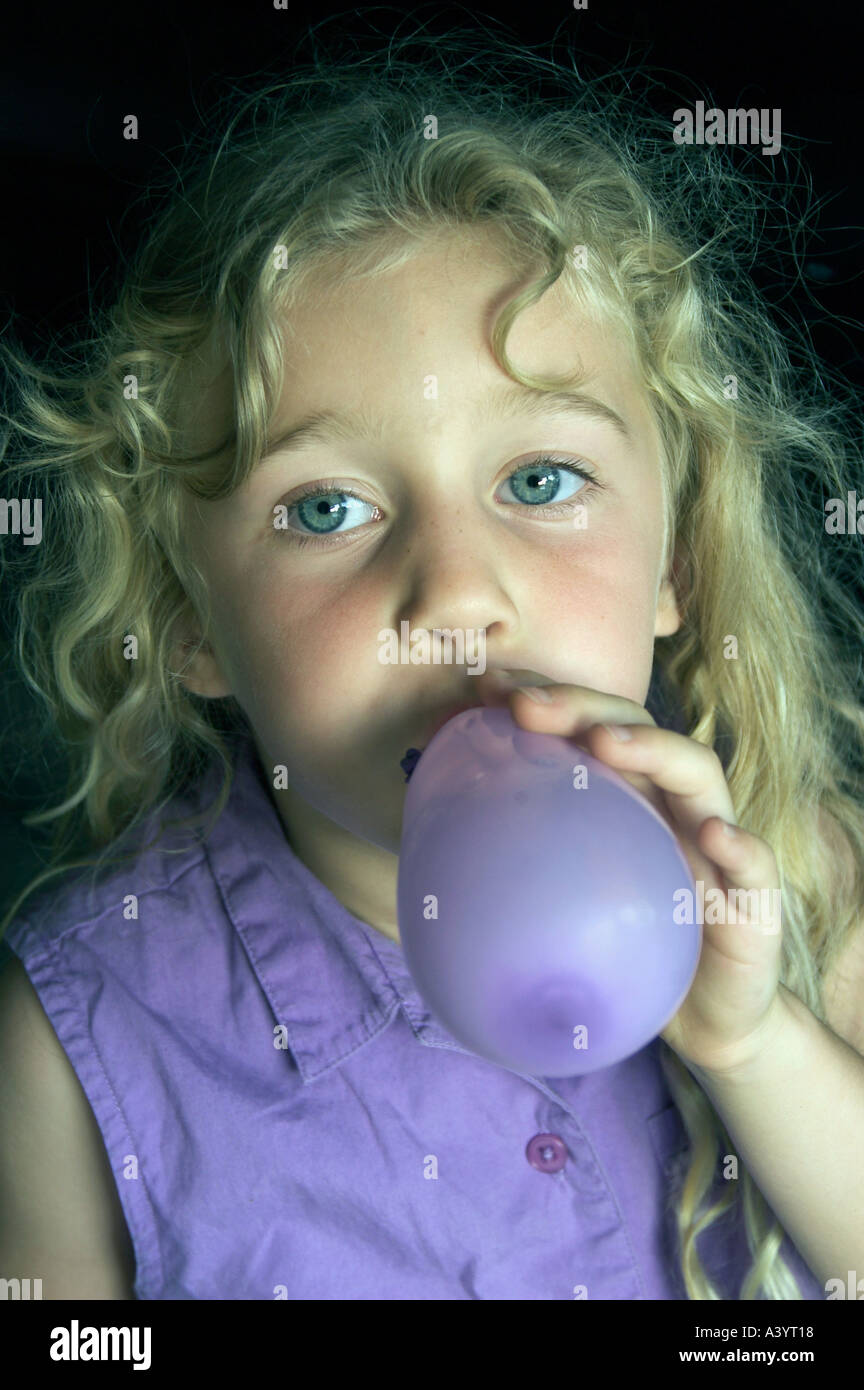 Blowing up balloon girl hi-res stock photography and images - Alamy