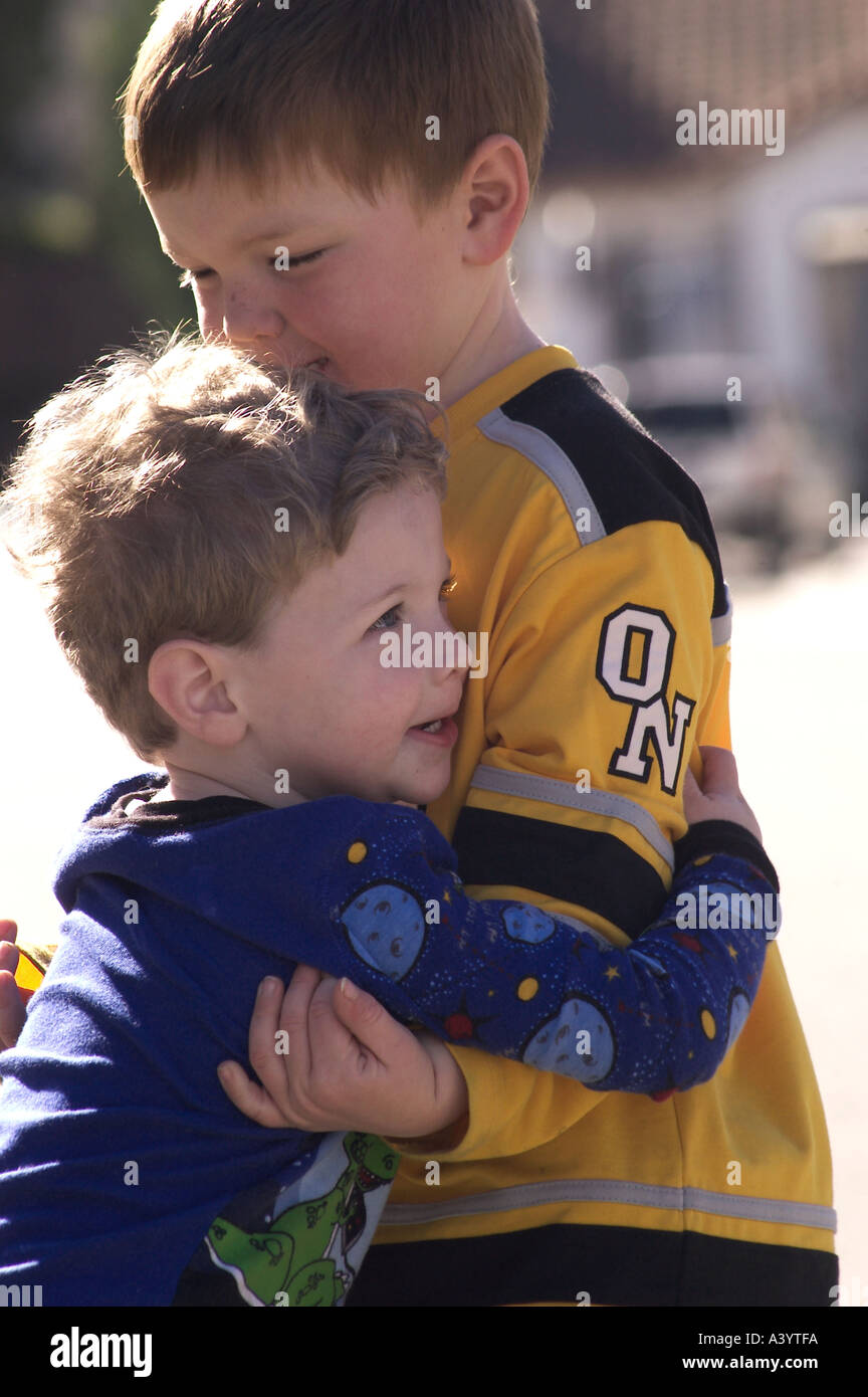 young friends hugging Stock Photo - Alamy
