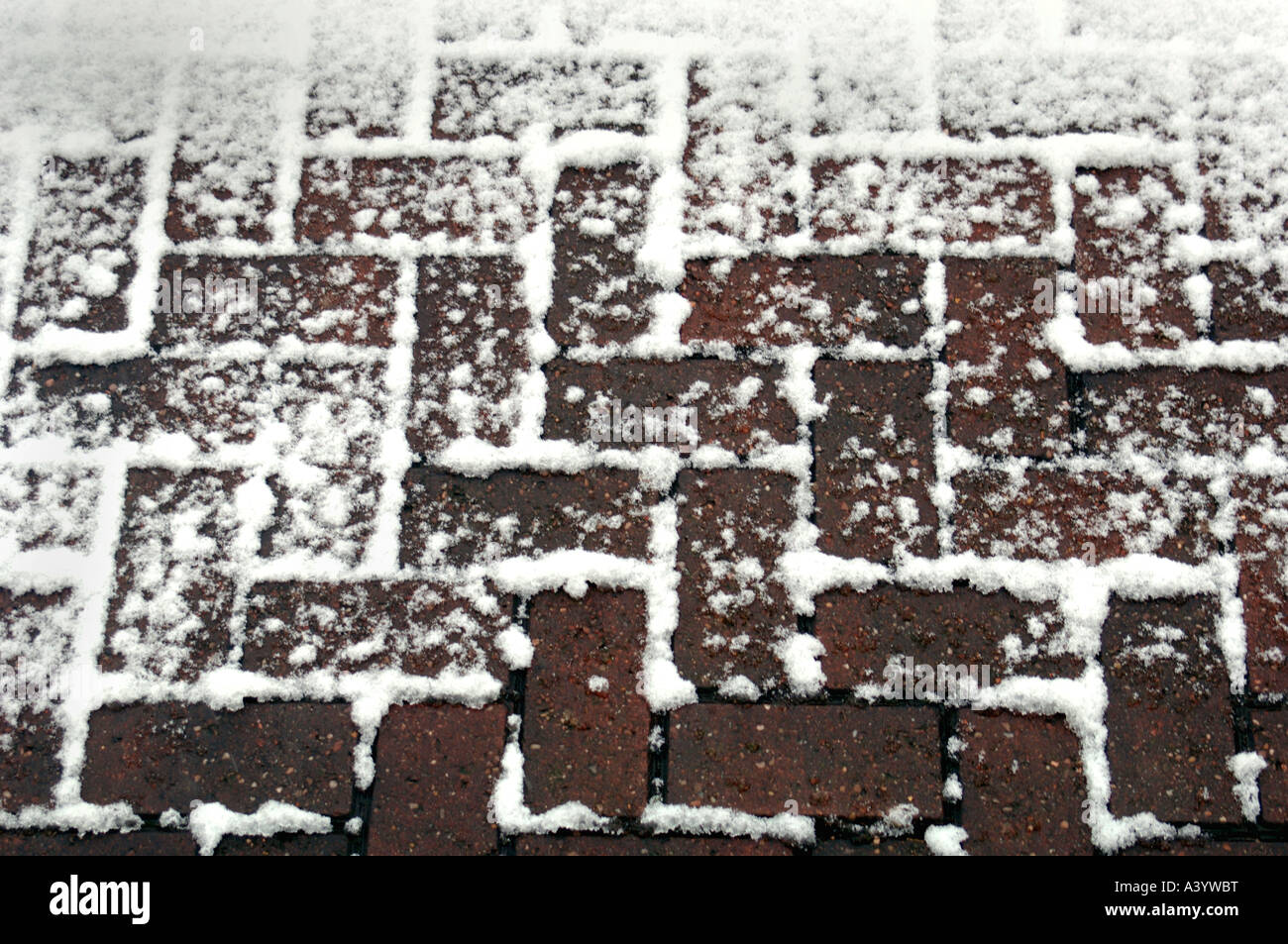 Abstract Snow Covered Brick Laid Pavement Stock Photo - Alamy