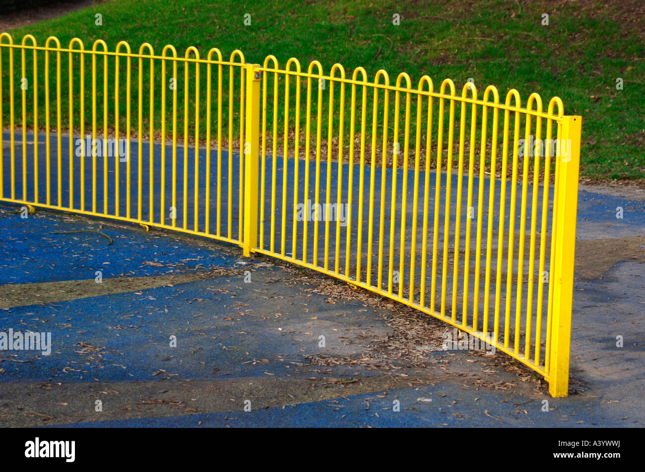 Bright Yellow Curved Metal Fencing Stock Photo - Alamy