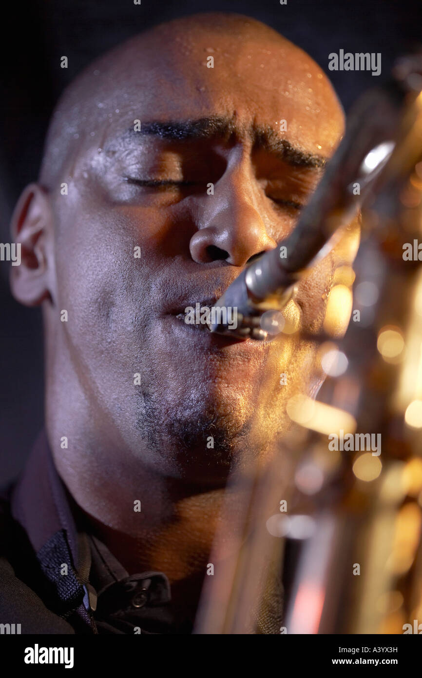 Saxophone player on stage, portrait, close-up Stock Photo - Alamy