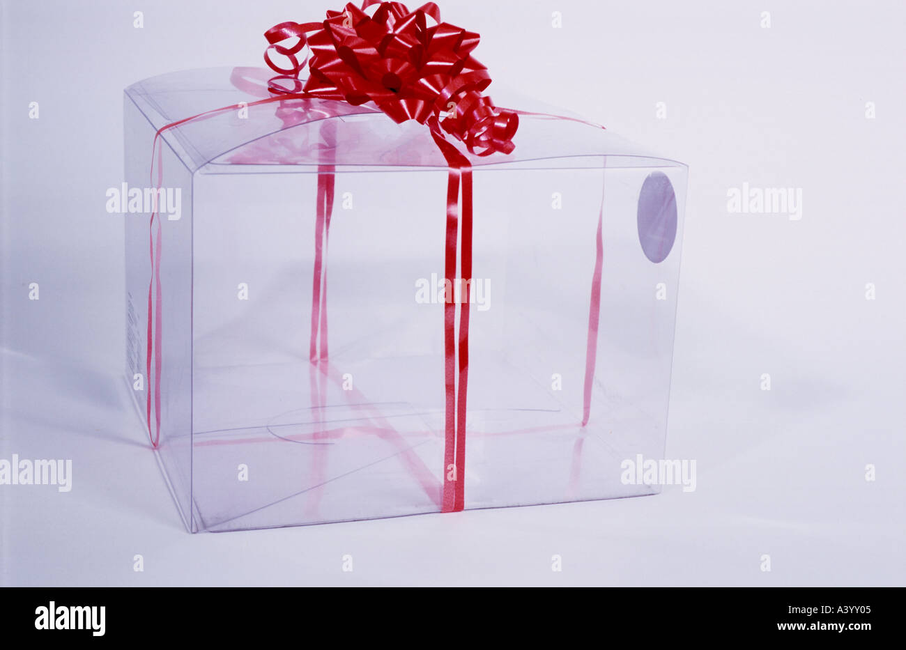 Clear transparent box wrapped with red ribbon but with nothing inside ...
