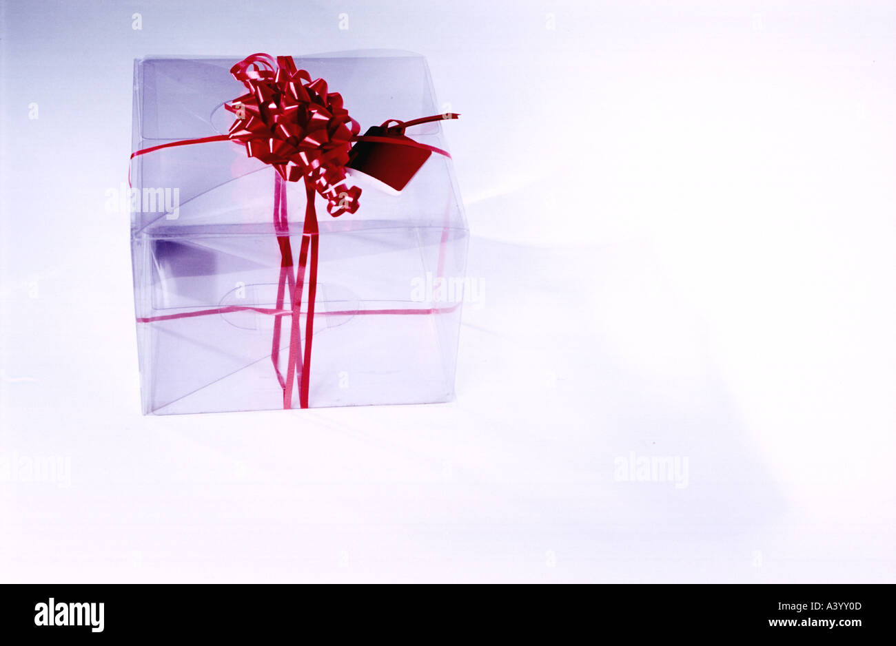 Clear transparent box wrapped with red ribbon but with nothing inside ...