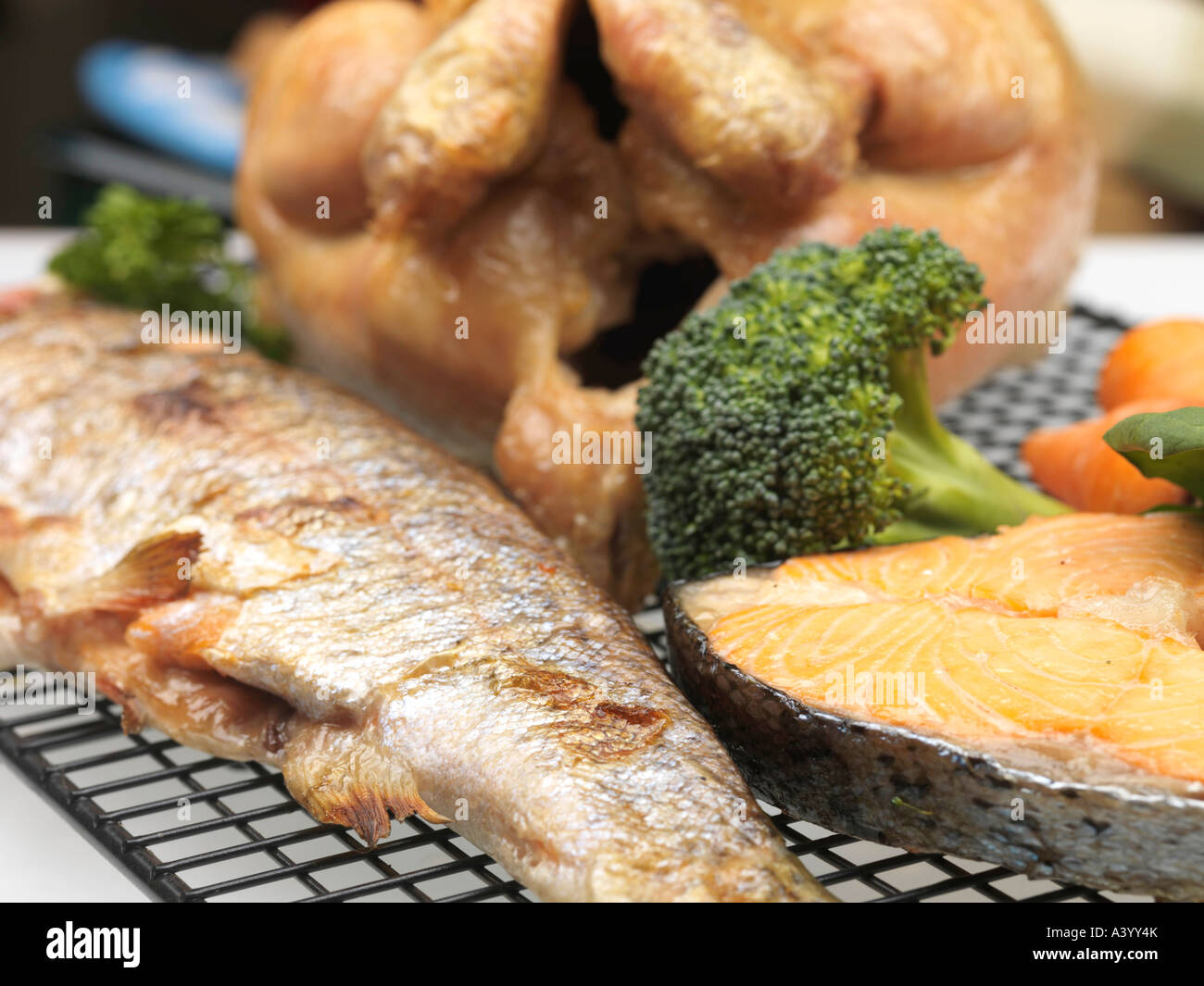 Roast Chicken with Vegetables and Fish Stock Photo - Alamy