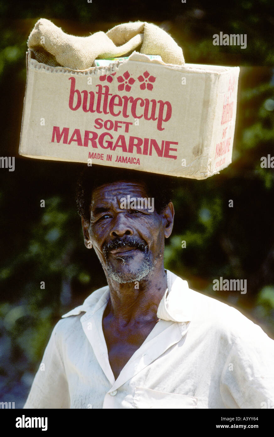 Man with butter box on head Kingston Jamaica Stock Photo - Alamy