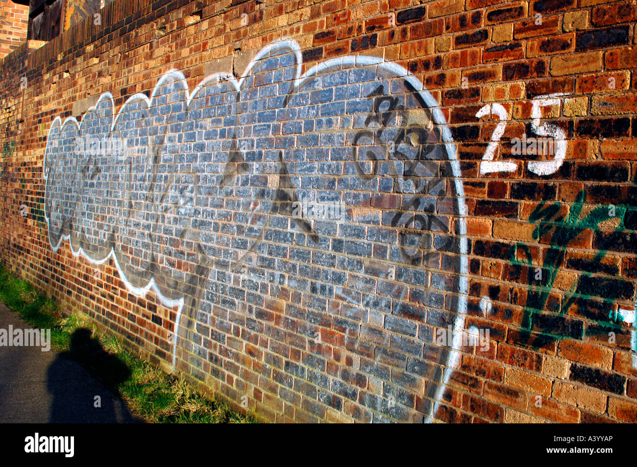 Graffiti Painted Onto A Brick wall Stock Photo - Alamy