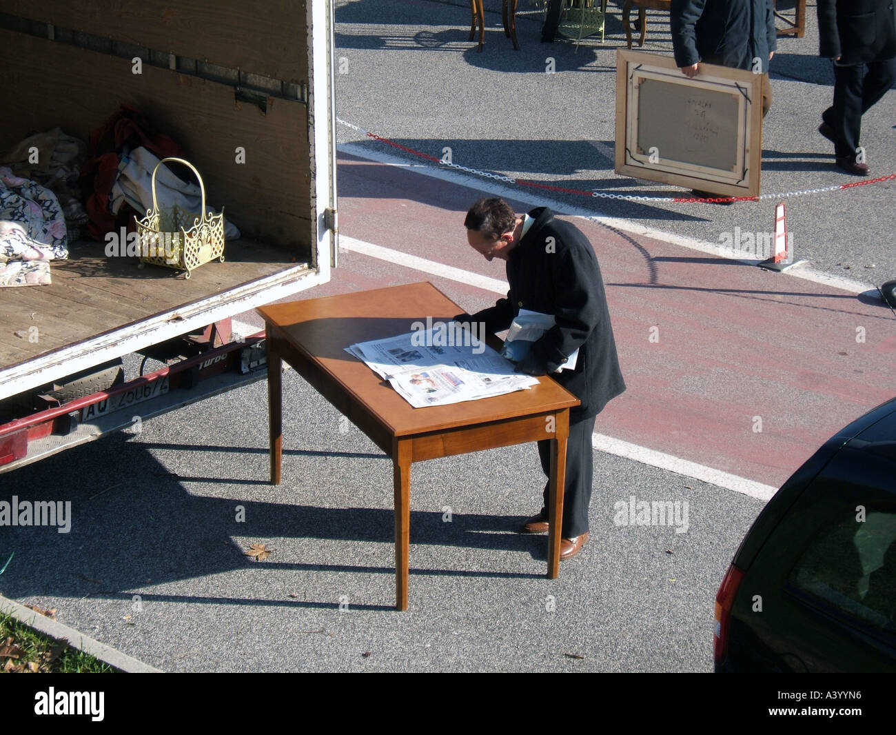 Man reading newspaper at newspaper stand in italy hi-res stock ...