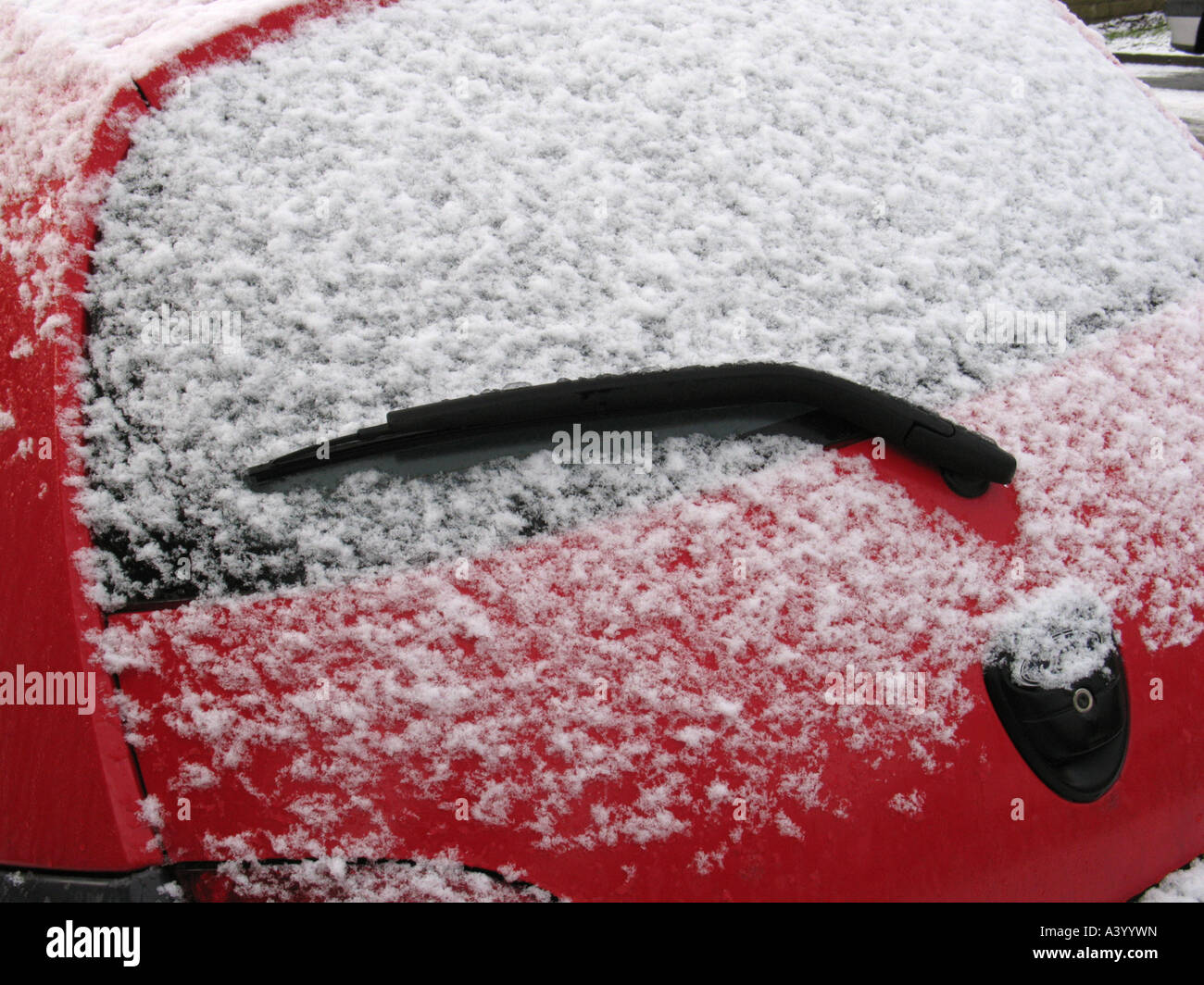 Snow on the rear screen of a car Stock Photo - Alamy