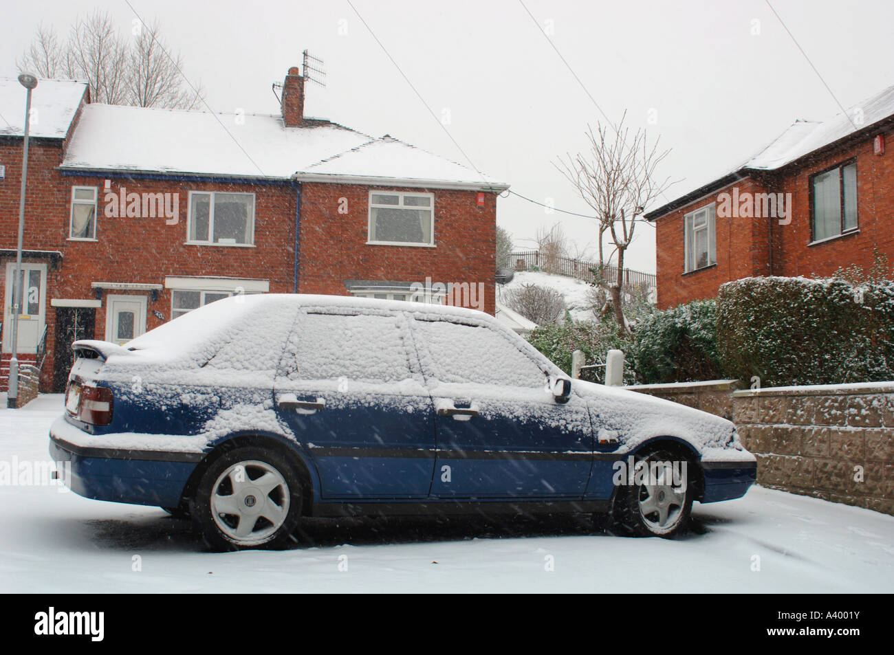 Parked Car Getting Covered By Falling Snow Stock Photo - Alamy